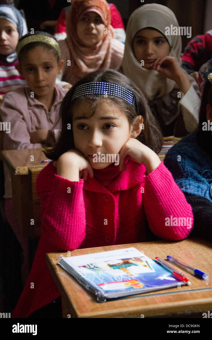 Children attend class at a newly opened school in Aleppo, Syria Stock ...
