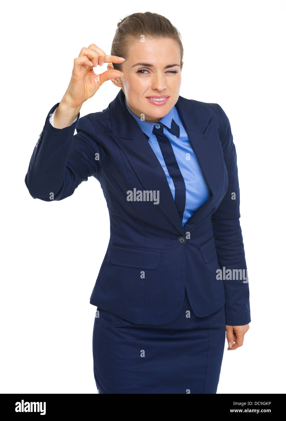 Business woman showing small risks gesture Stock Photo - Alamy