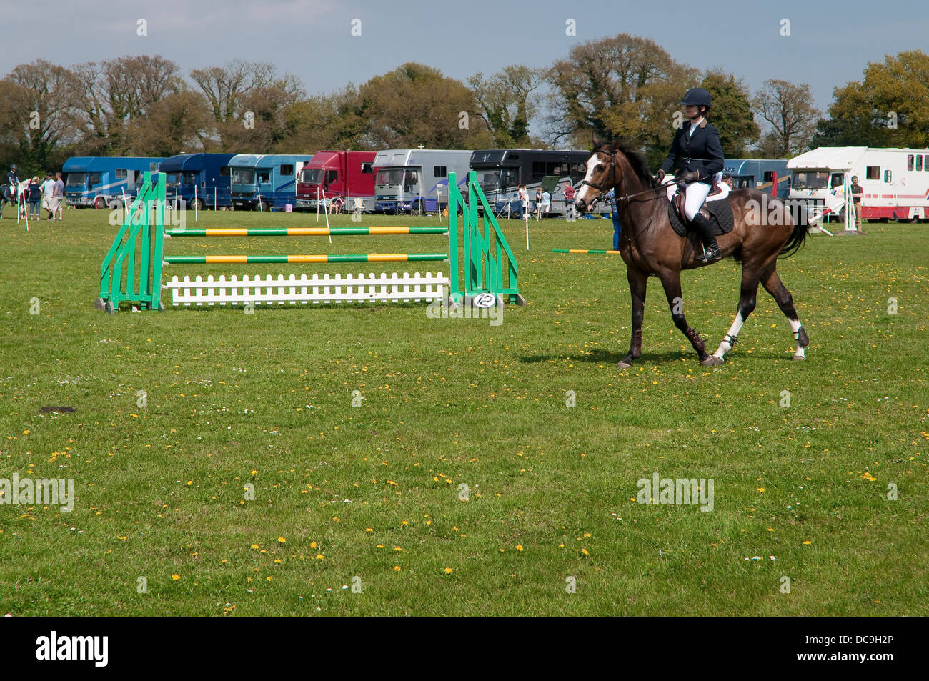 Female horse rider at the Suffolk Horse Show jumping competition ...