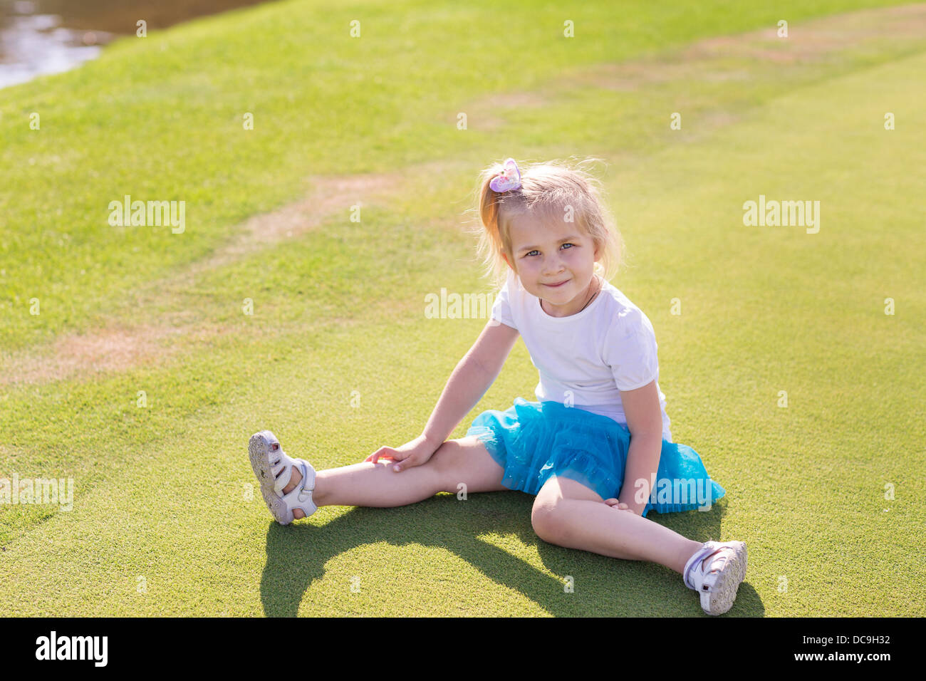 Cute little girl playing golf on a field outdoor Stock Photo - Alamy