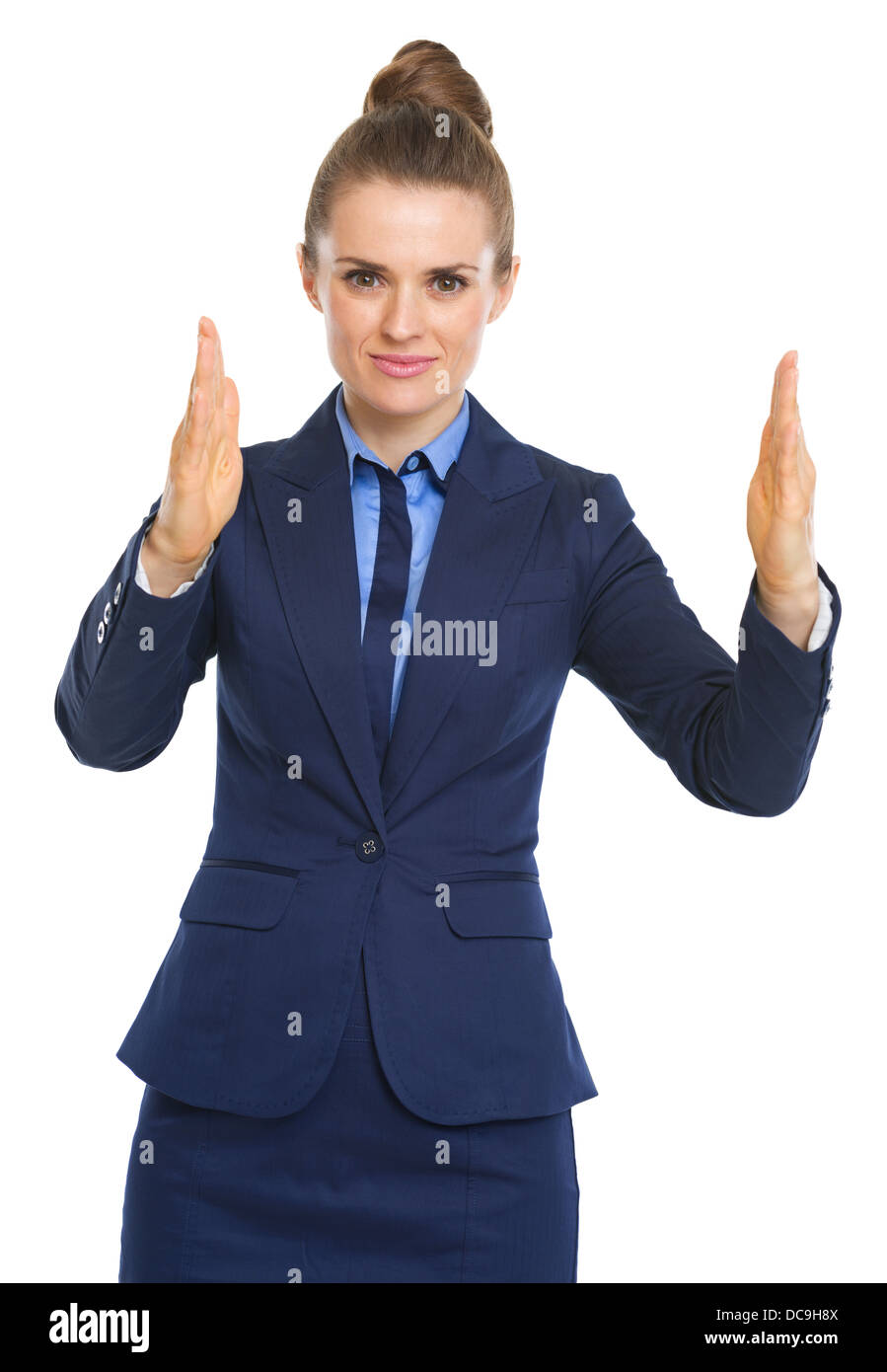 Business woman showing something big Stock Photo - Alamy