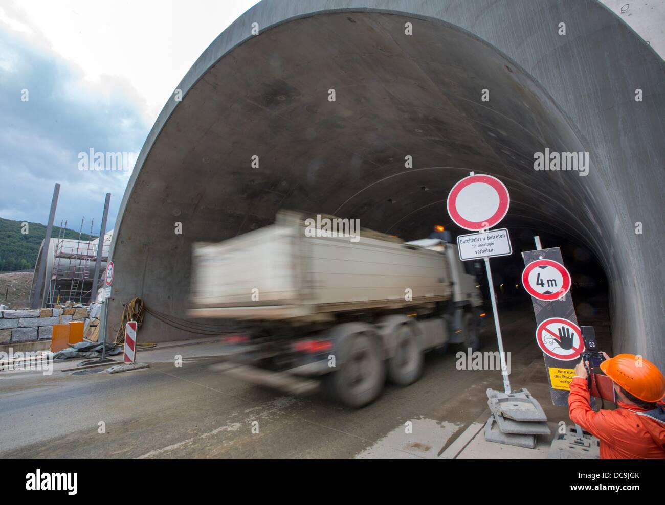 Jena, Germany. 13th Aug, 2013. A construction vehichle is driven into ...
