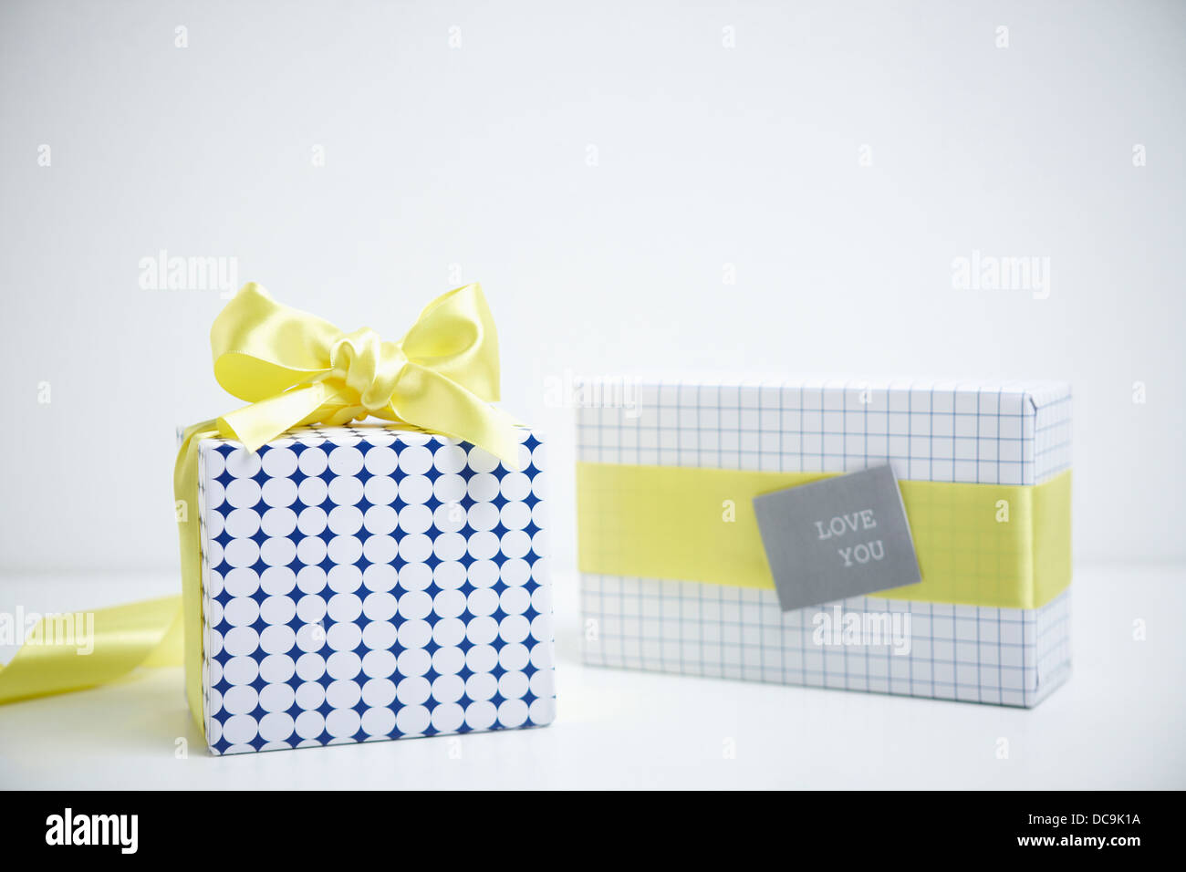 gift boxes in yellow colour Stock Photo - Alamy