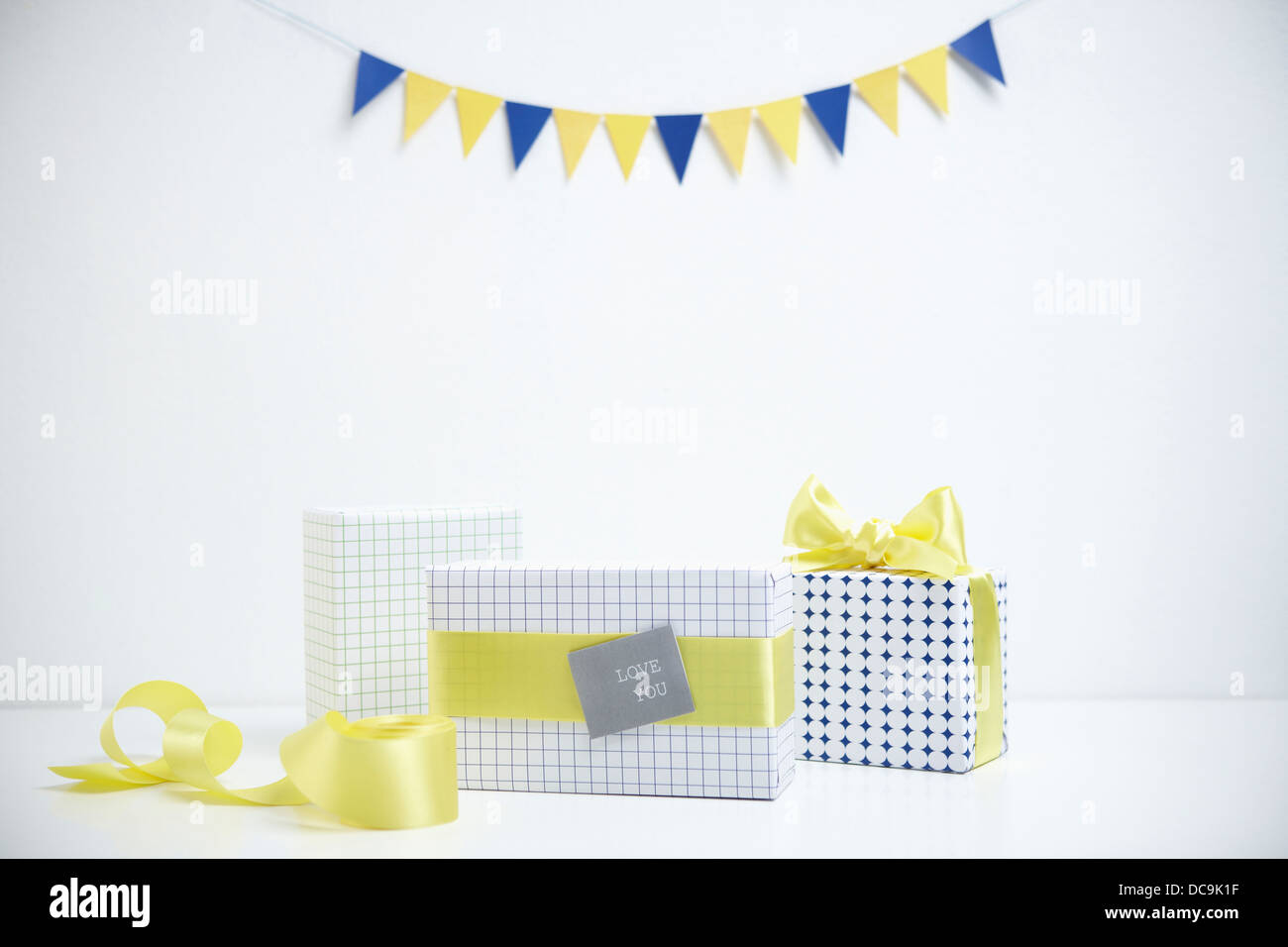 gift boxes in yellow colour Stock Photo - Alamy