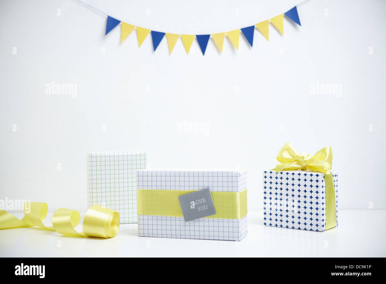 gift boxes in yellow colour Stock Photo - Alamy