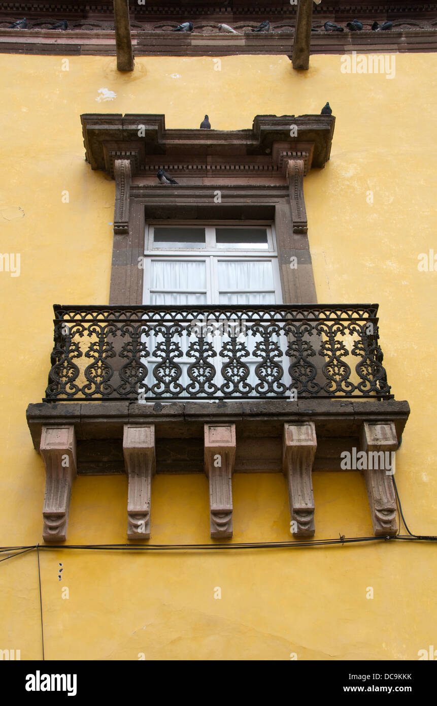 Colonial balcony. View on a typical urban scene with closed French ...