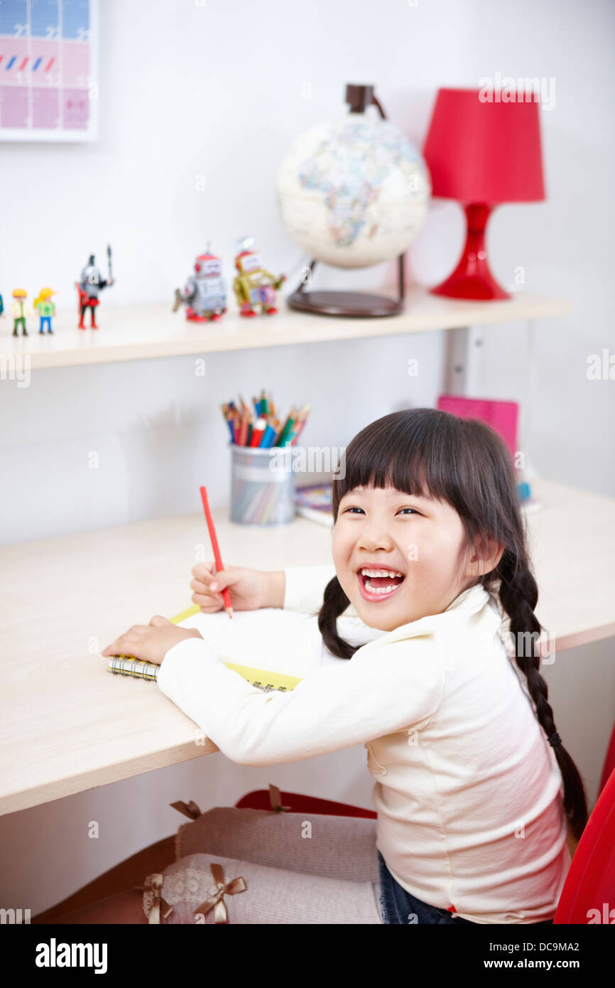 a kid studying at table Stock Photo - Alamy