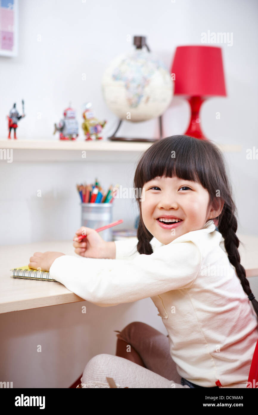 a kid studying at table Stock Photo - Alamy