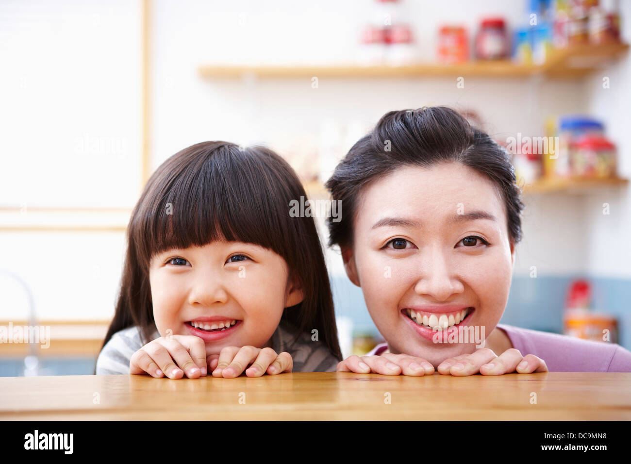 Mother daughter table hide hi-res stock photography and images - Alamy