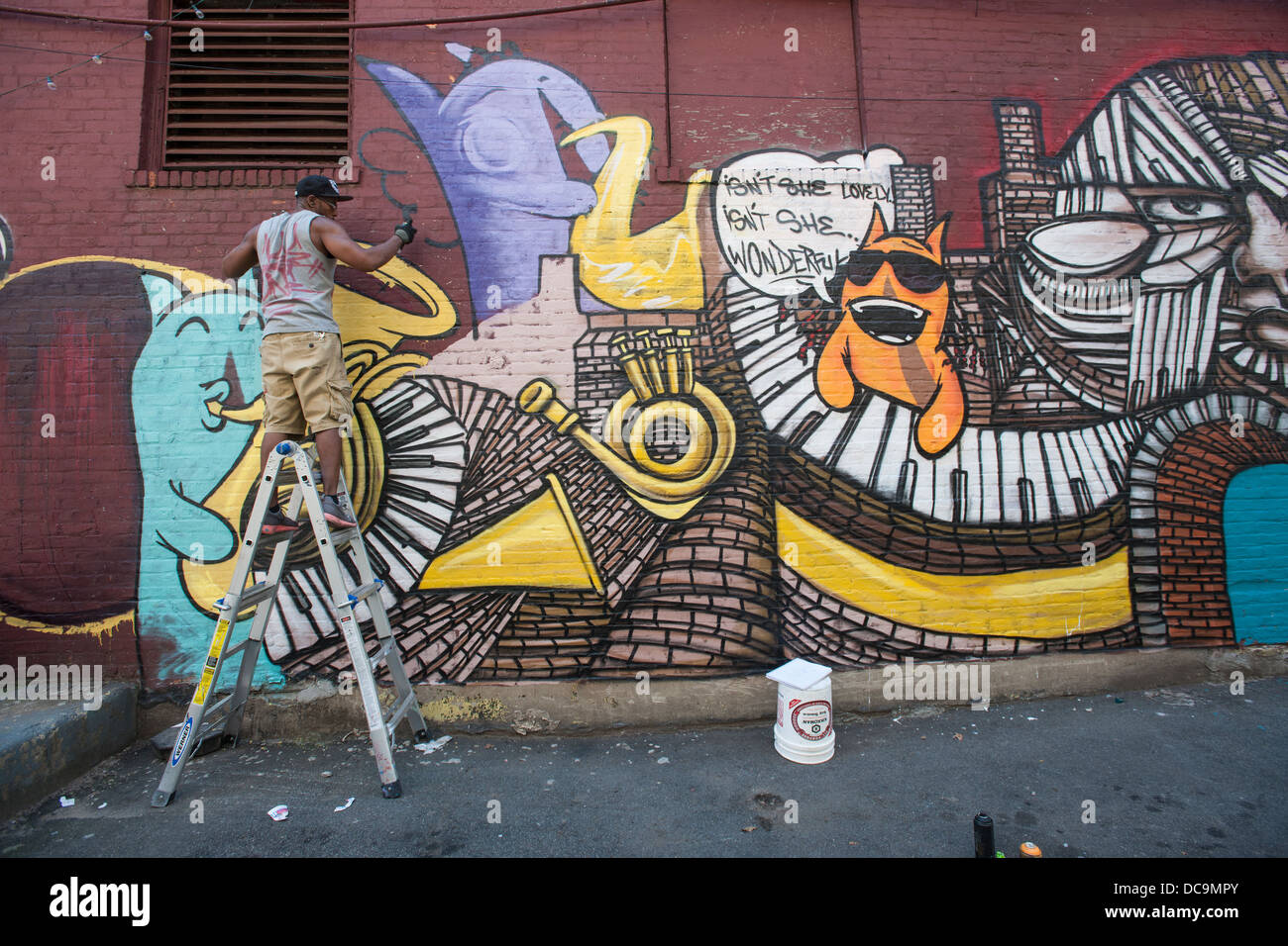 See One paints the "Follow the BEAT" street art mural on a wall in ...