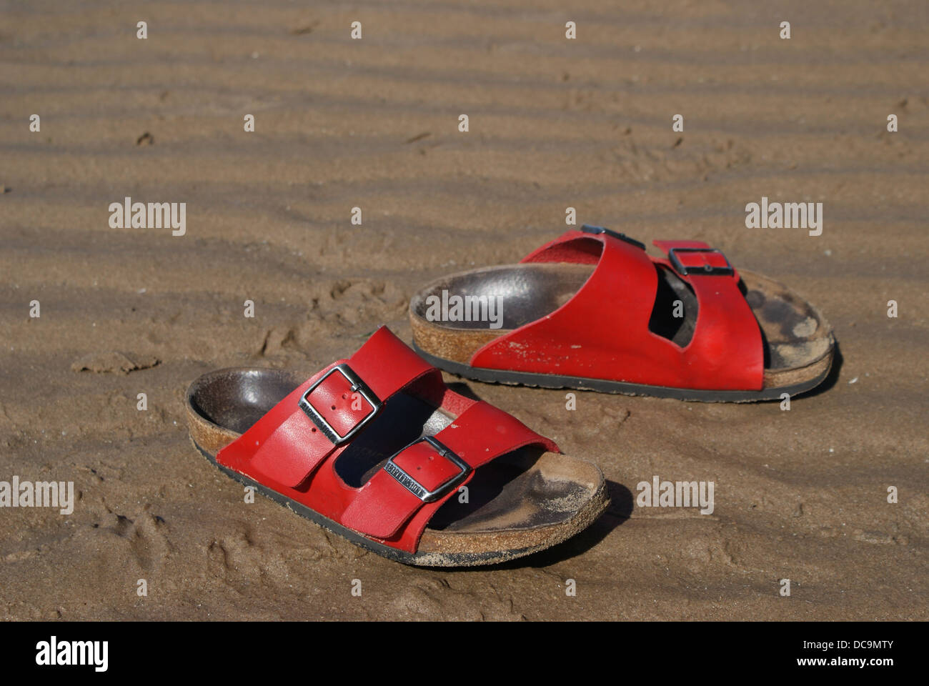 Red Birkenstock sandals on the beach Stock Photo - Alamy