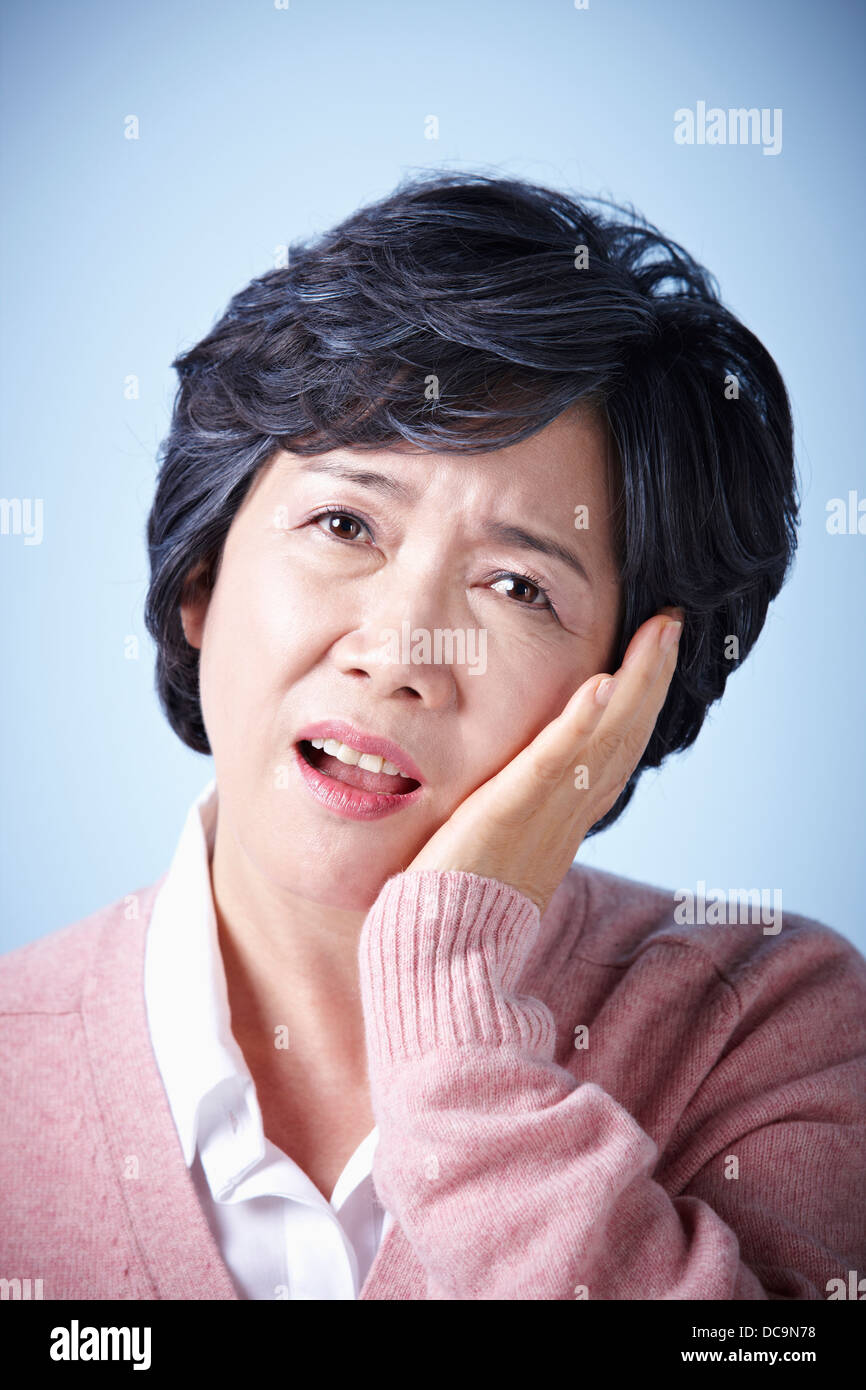 Frowning middle aged woman hi-res stock photography and images - Alamy