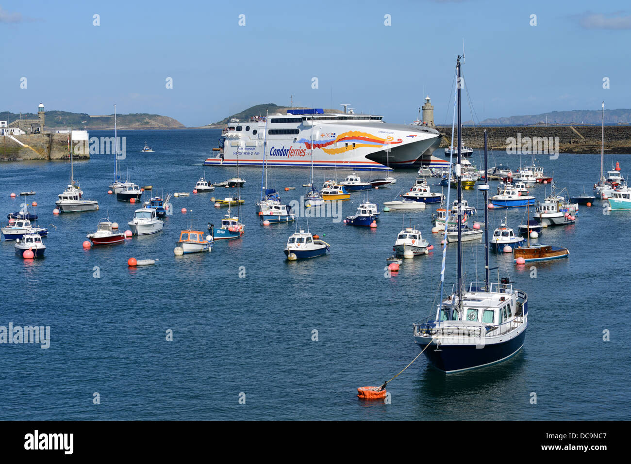 Condor Passenger Ferry manoeuvres into St Peter Port harbour, Guernsey ...