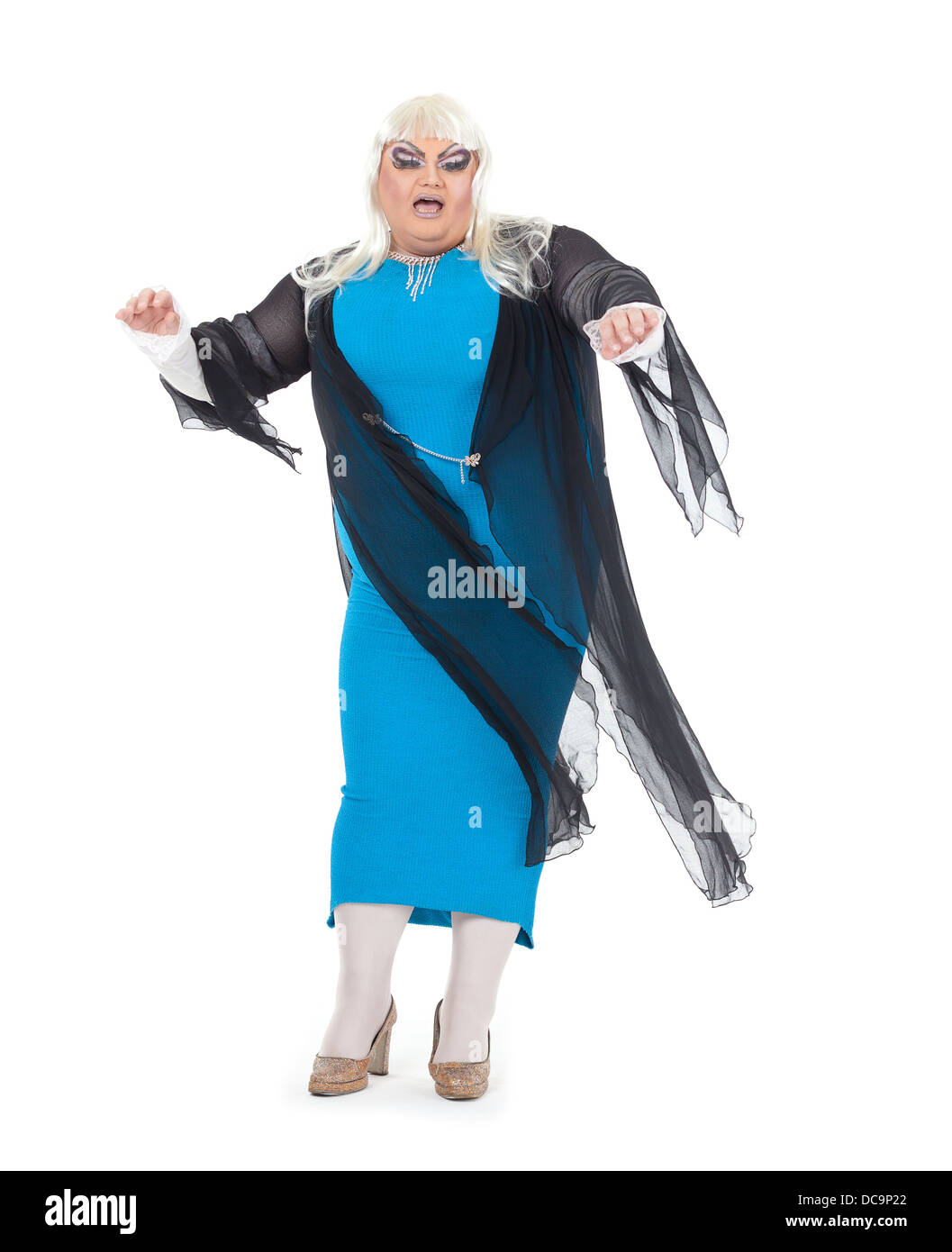 Drag queen dressed as a female singer in a dress and wig performing ...