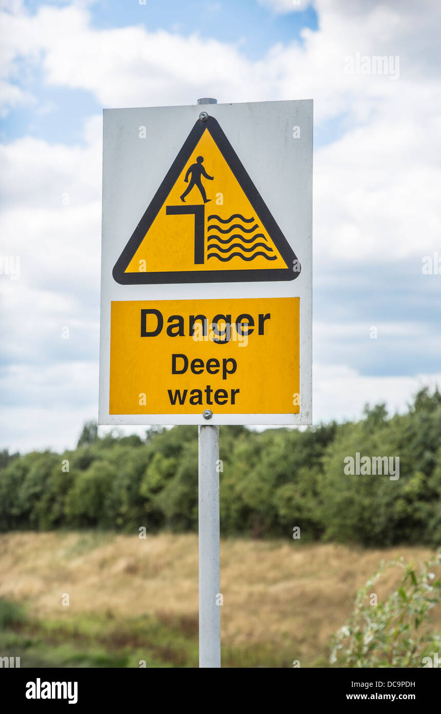 Yellow and black warning sign with caption, Danger Deep water Stock ...