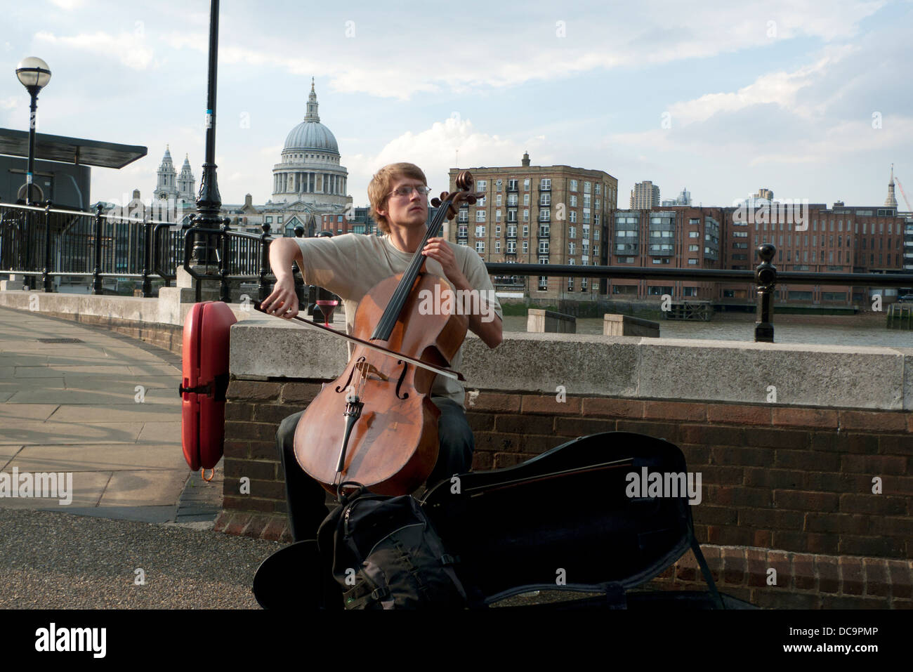Young man busker playing classical hi-res stock photography and images ...