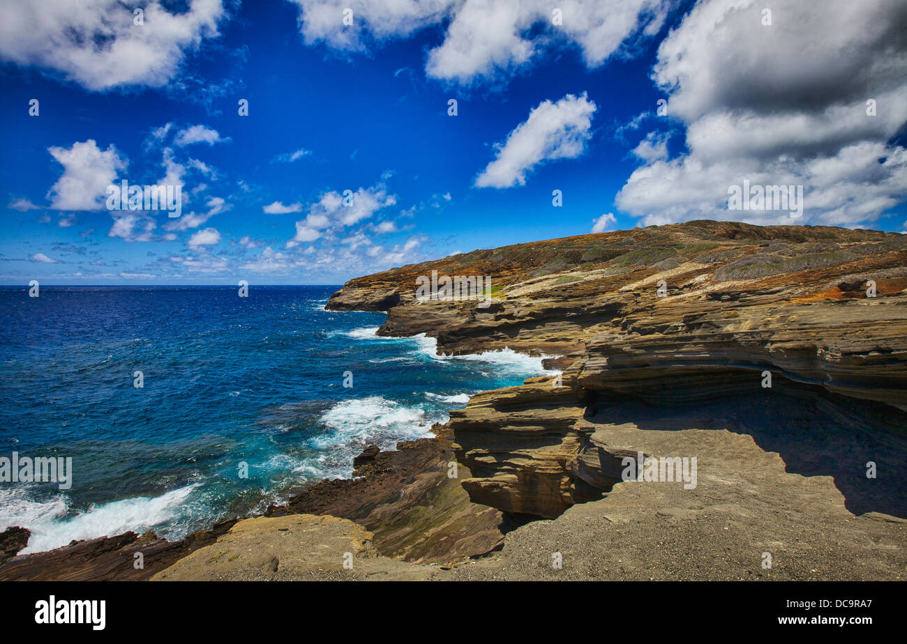 Coastline Cliff Rock formation on Oahu, Hawaii with blue sky and clouds ...