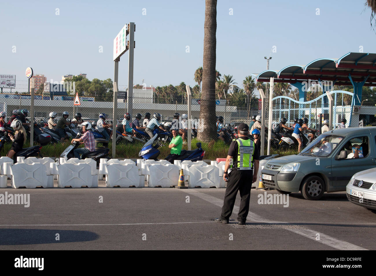 Gibraltar. 13th August 2013. A Gibraltar police officer controls ...