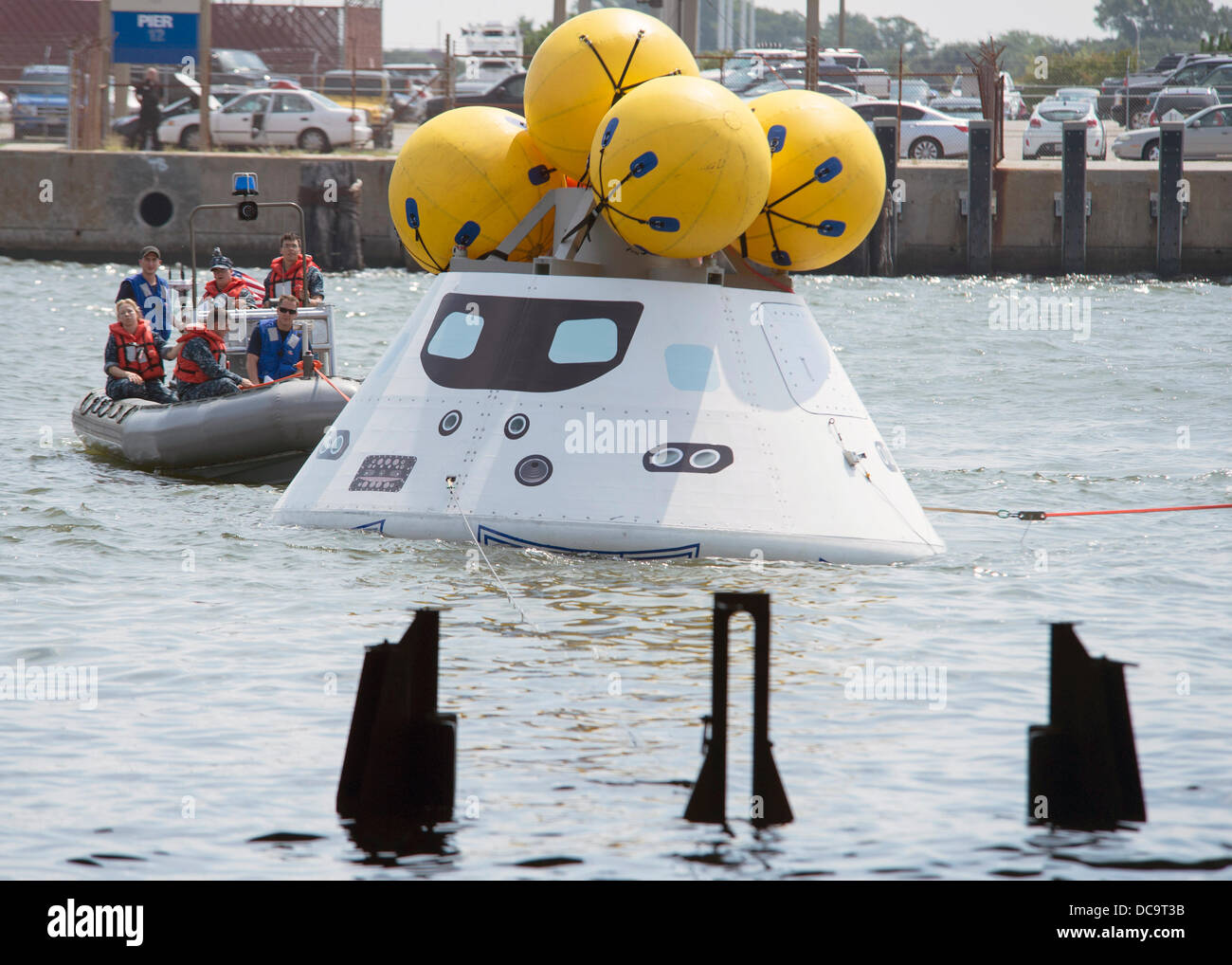 US Navy sailors assist in a recover exercise of the new Orion capsule ...
