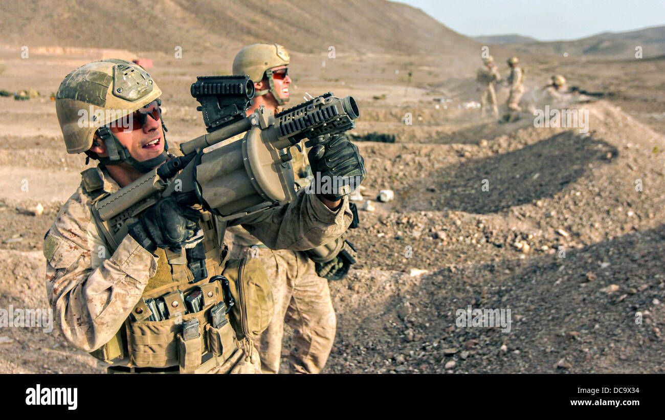 US Marines Maritime Raid Force commandos fire an M32 Multiple Grenade ...
