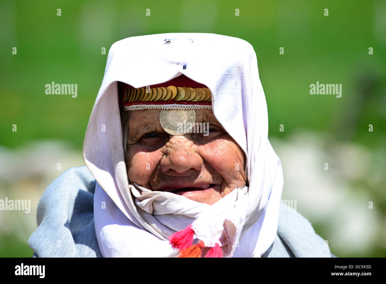 An old Dinaric highlander wearing traditional head wear and ornaments ...