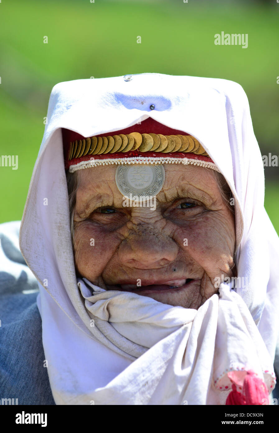 An old Dinaric highlander wearing traditional head wear and ornaments ...