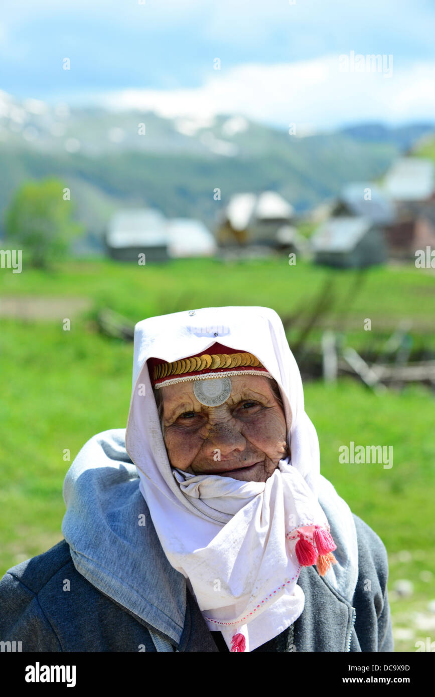 An old Dinaric highlander wearing traditional head wear and ornaments ...