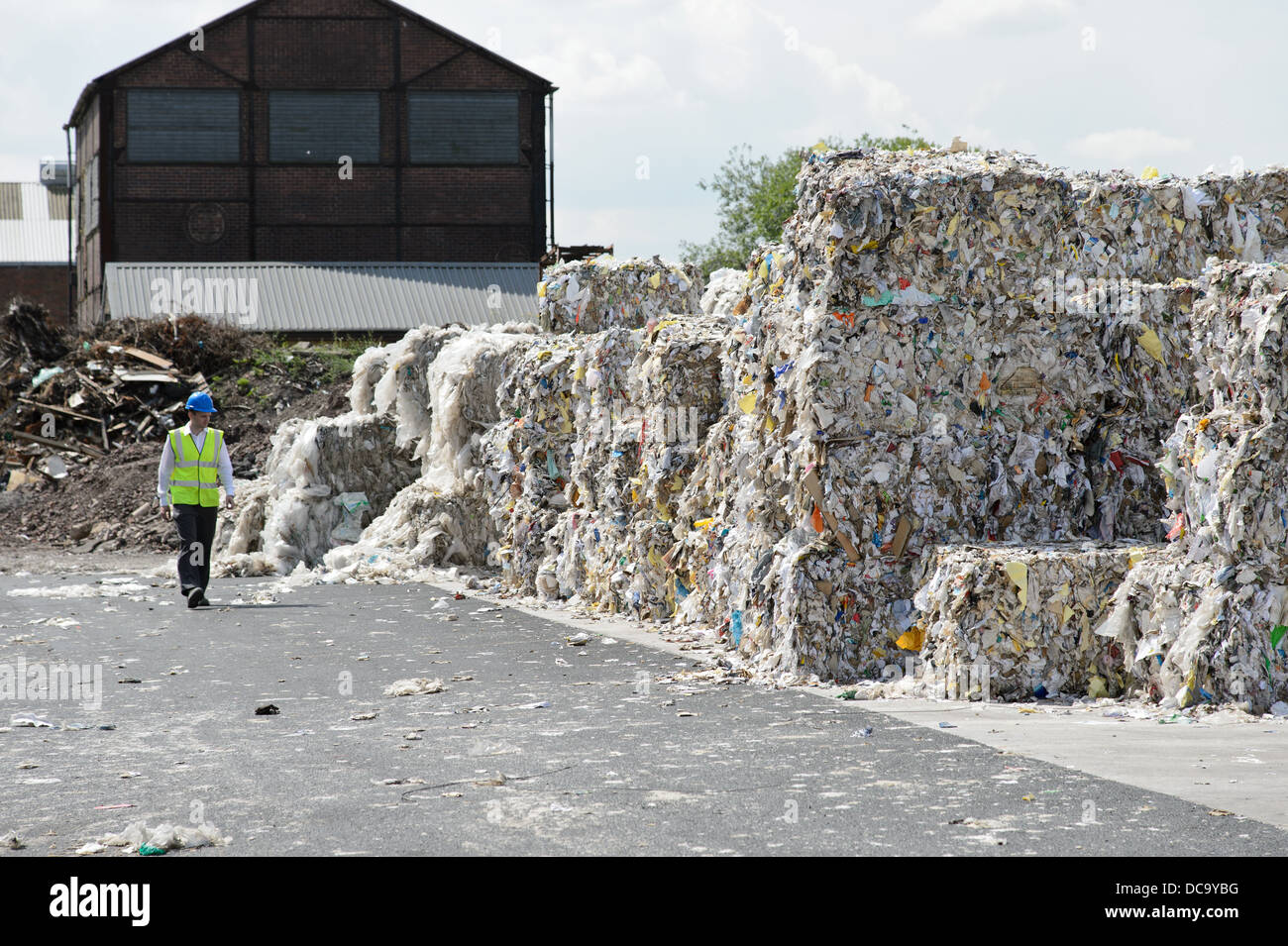 Bales of waste paper at a waste recycling plant in the West Midlands ...