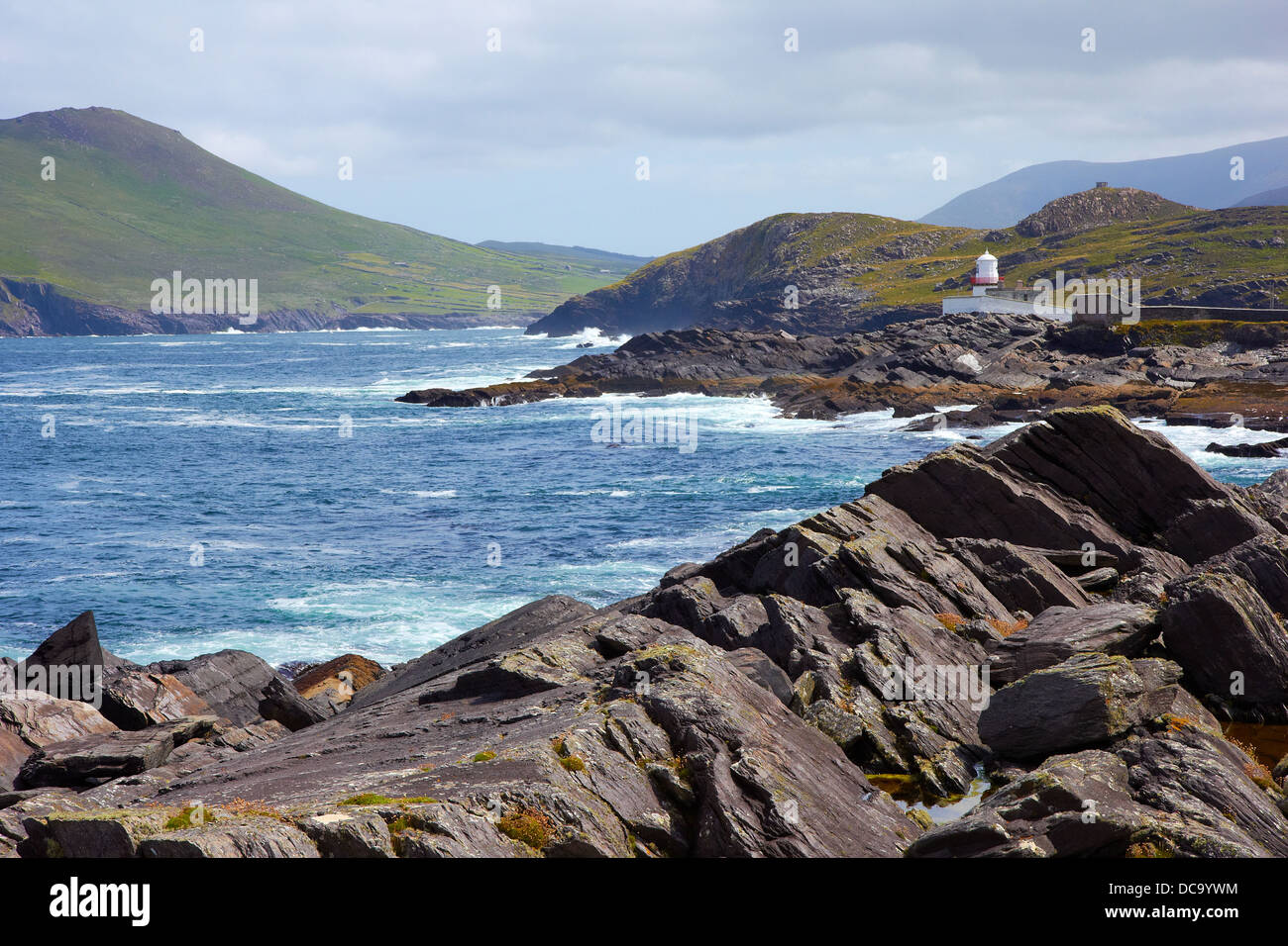 Valentia Lighthouse, County Kerry, Ireland on rocks with waves from ...