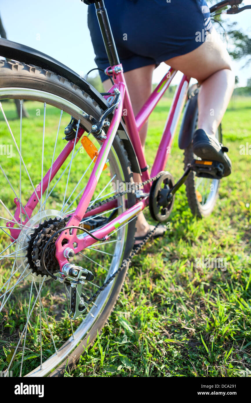 Back view girl riding bicycle hi-res stock photography and images - Alamy
