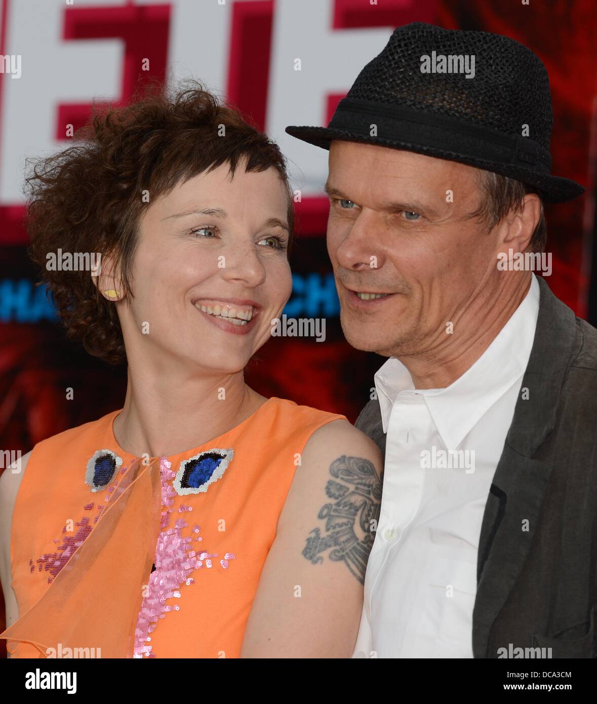 Berlin, Germany. 13th Aug, 2013. Actors Meret Becker (L) and Edgar ...