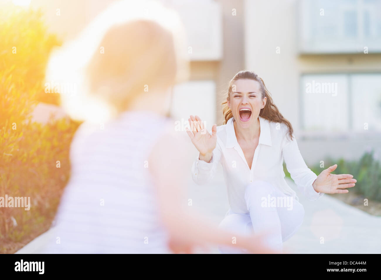 Woman baby running hi-res stock photography and images - Alamy