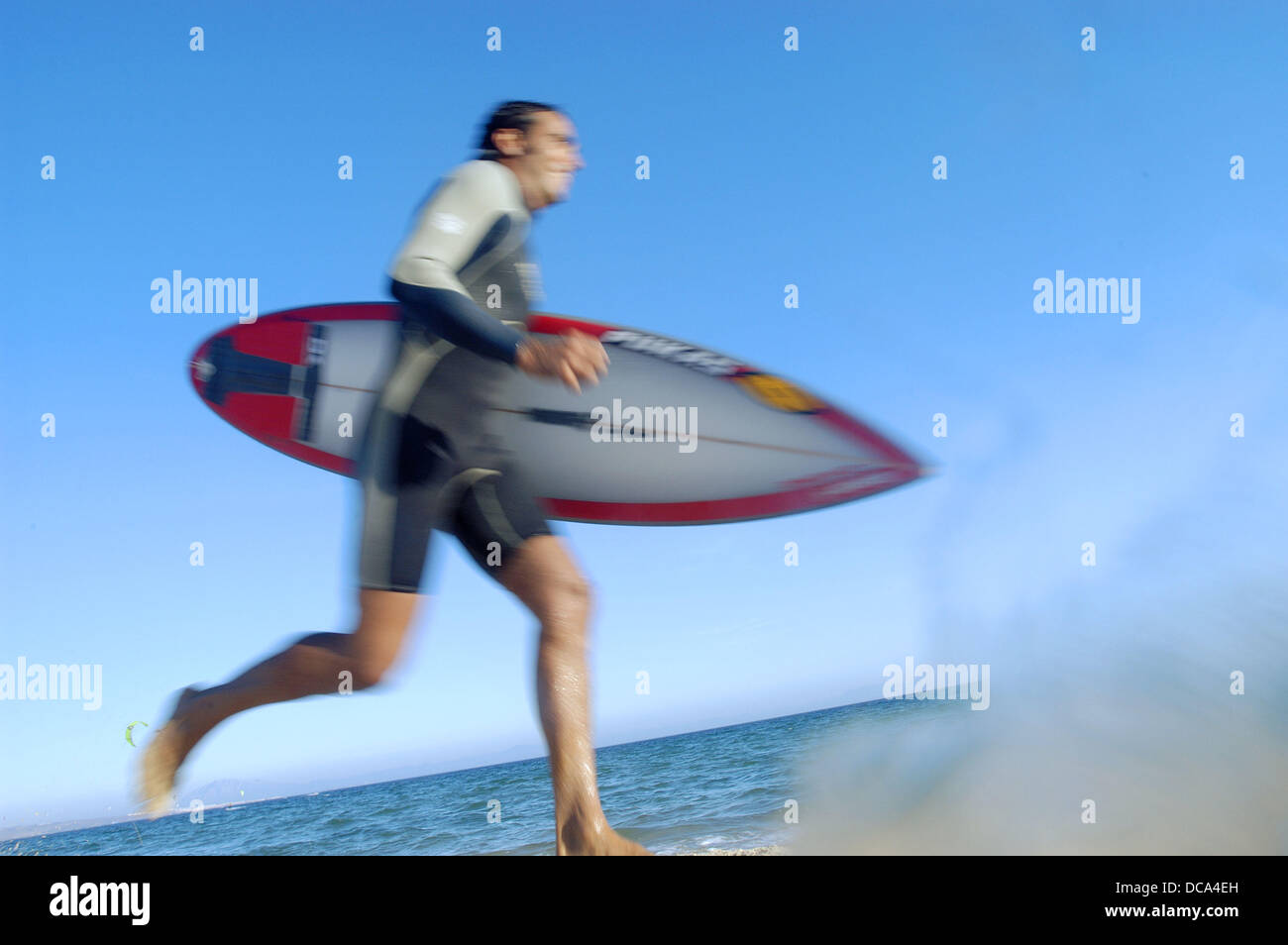 Running carrying surf board surfboard hi-res stock photography and ...