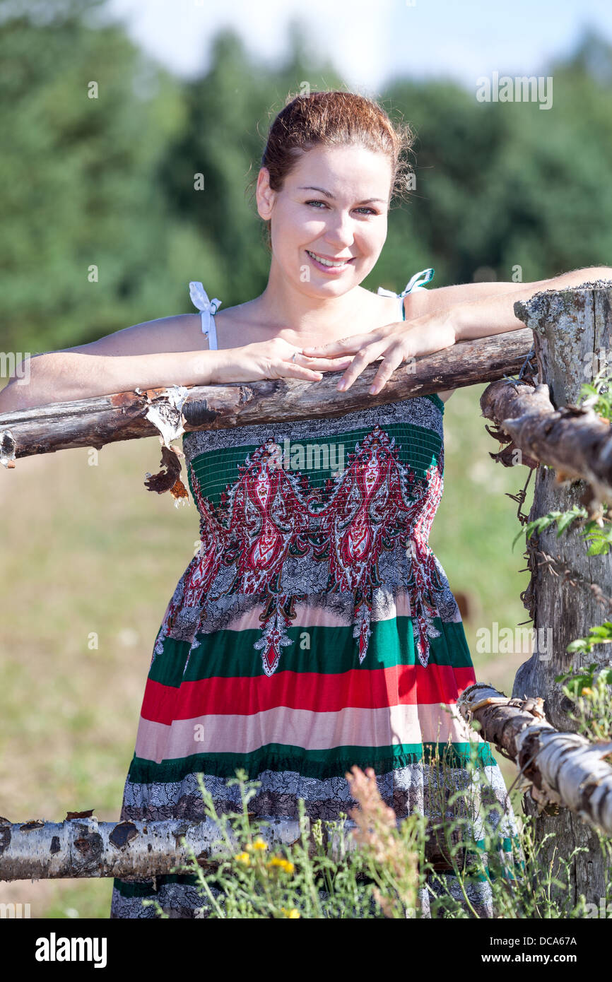 Happy smiling village girl in sundress looking at camera Stock Photo ...