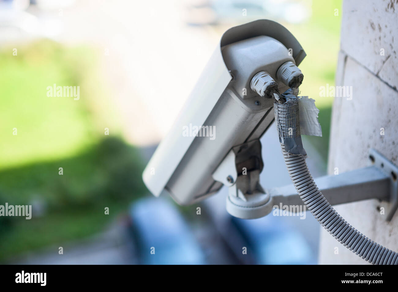Video surveillance camera on a wall of the building, close up view ...