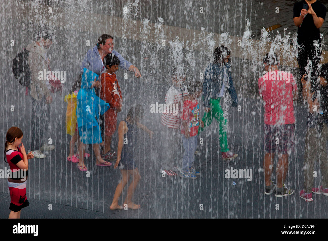 People Playing In The Appearing Rooms, Interactive Water Fountains, The ...