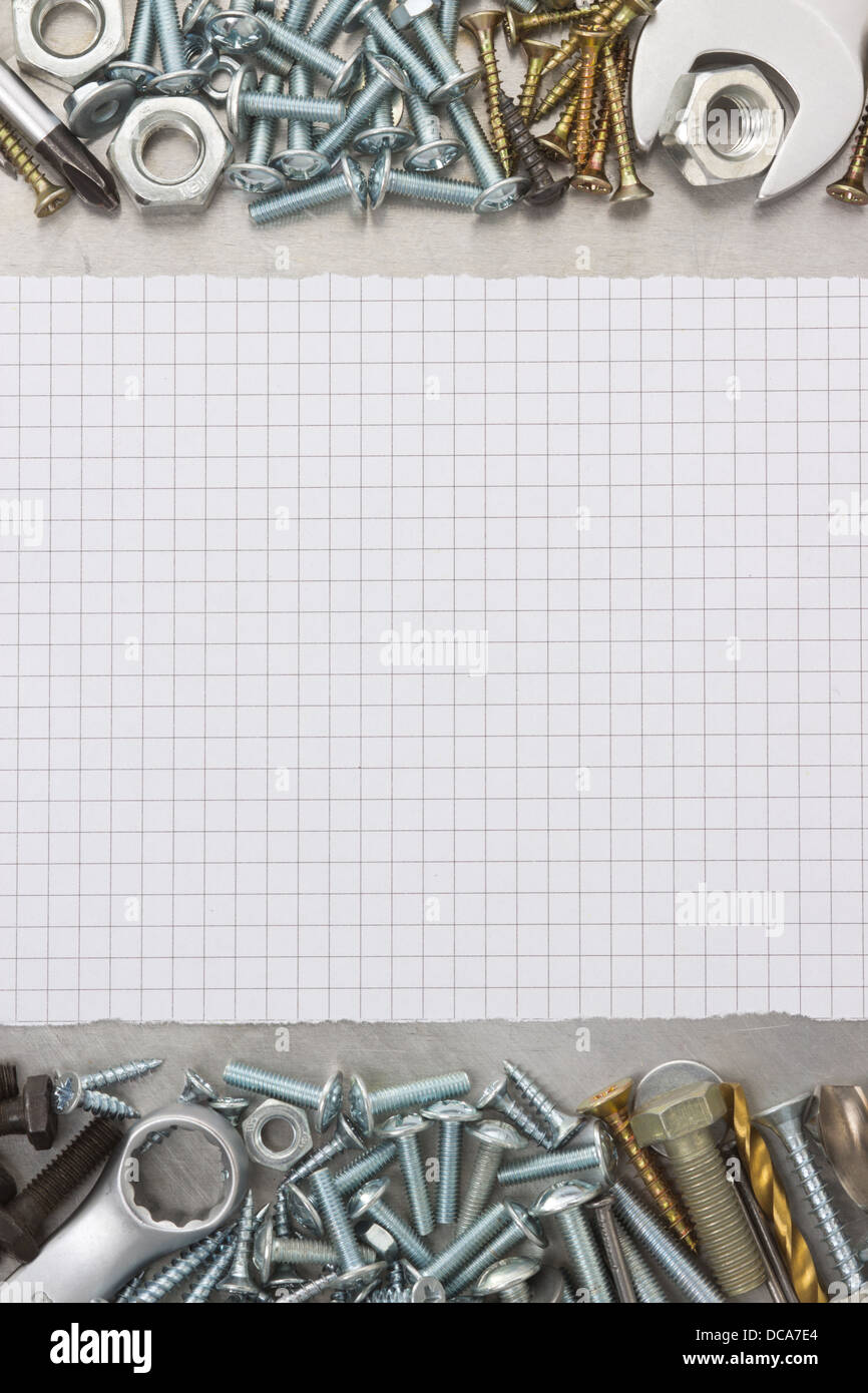 metal construction hardware tool and checked paper Stock Photo - Alamy
