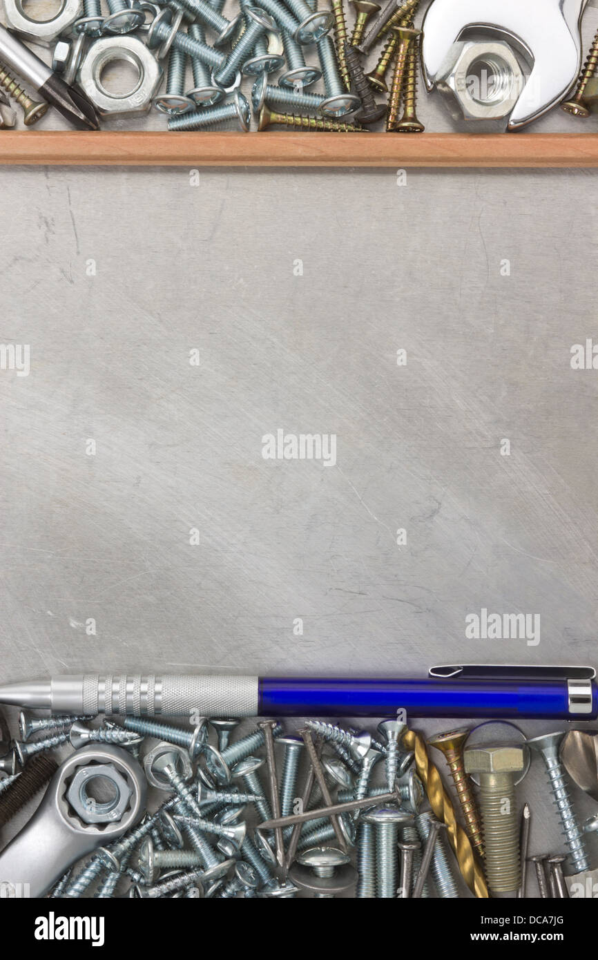 metal construction hardware tool on metal texture Stock Photo - Alamy
