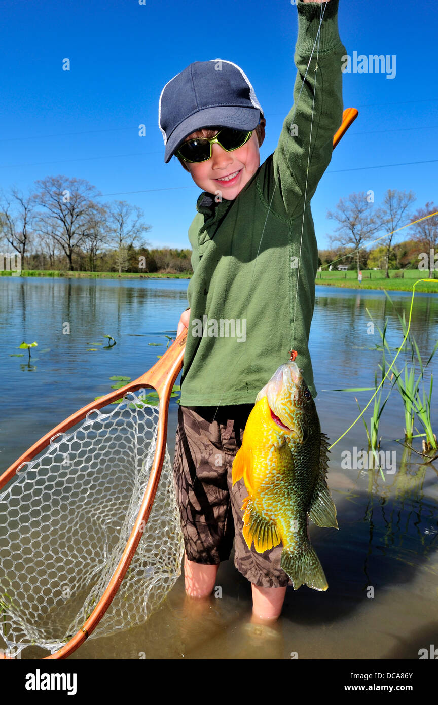 Young boy fishing in a Pennsylvania pond Stock Photo - Alamy