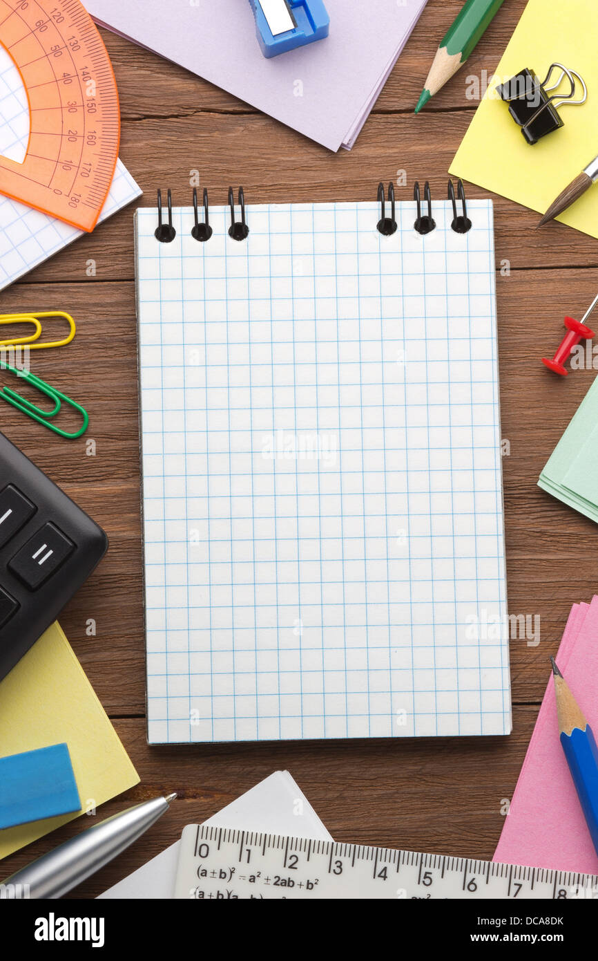 school supplies and checked notebook on wood background Stock Photo - Alamy