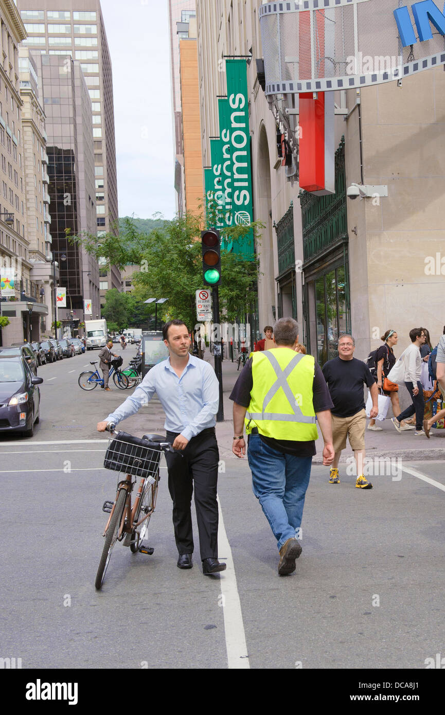 Man pushing his bicycle hi-res stock photography and images - Alamy