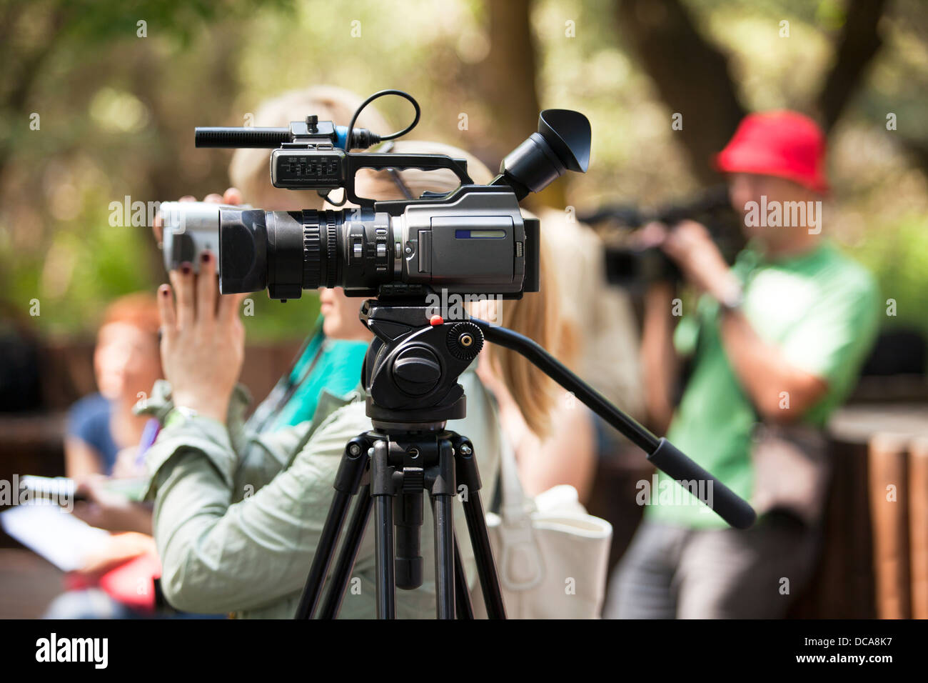 covering an event with a video camera Stock Photo - Alamy