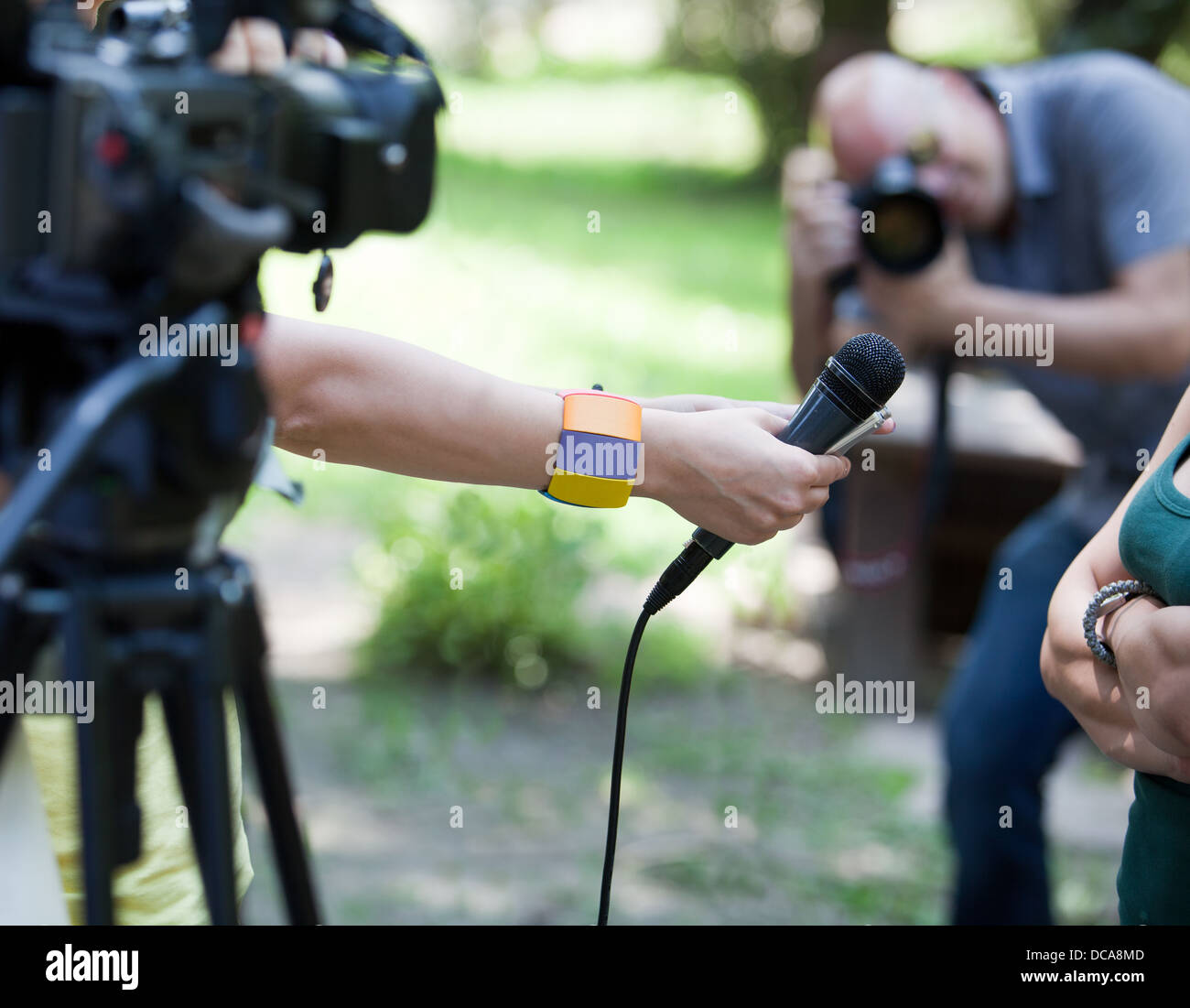 journalist hand holding a microphone conducting an TV or radio ...