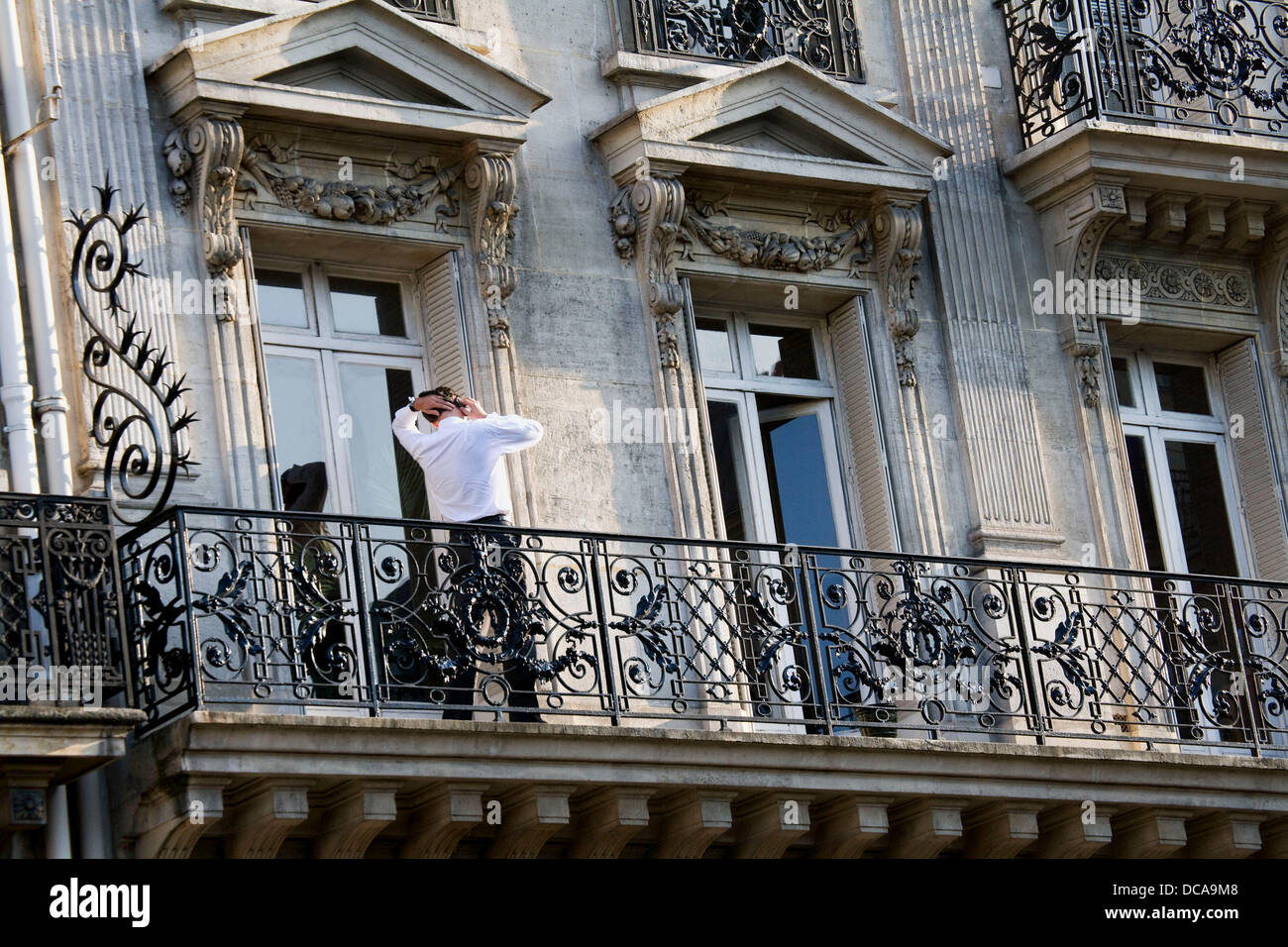 Man using cell phone, Paris, France Stock Photo - Alamy
