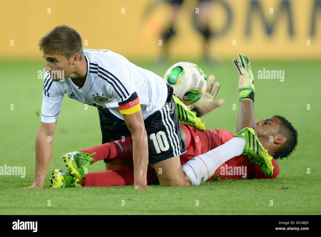 Moritz Leitner of Germany and goalkeeper Zacharie Boucher (R) of France ...