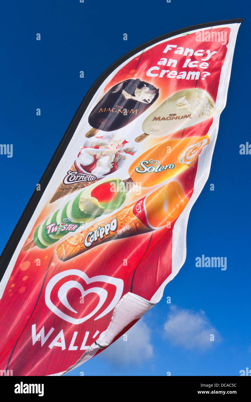 Walls ice cream advertising flag flying at the seaside Stock Photo - Alamy