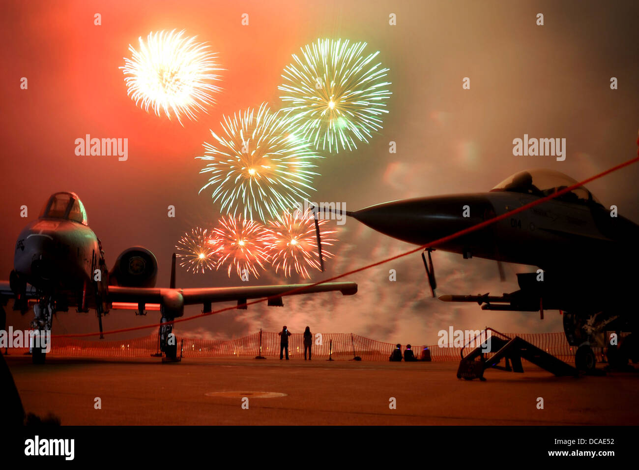 Fireworks erupt behind an A-10 Thunderbolt II and an F-16 Fighting ...