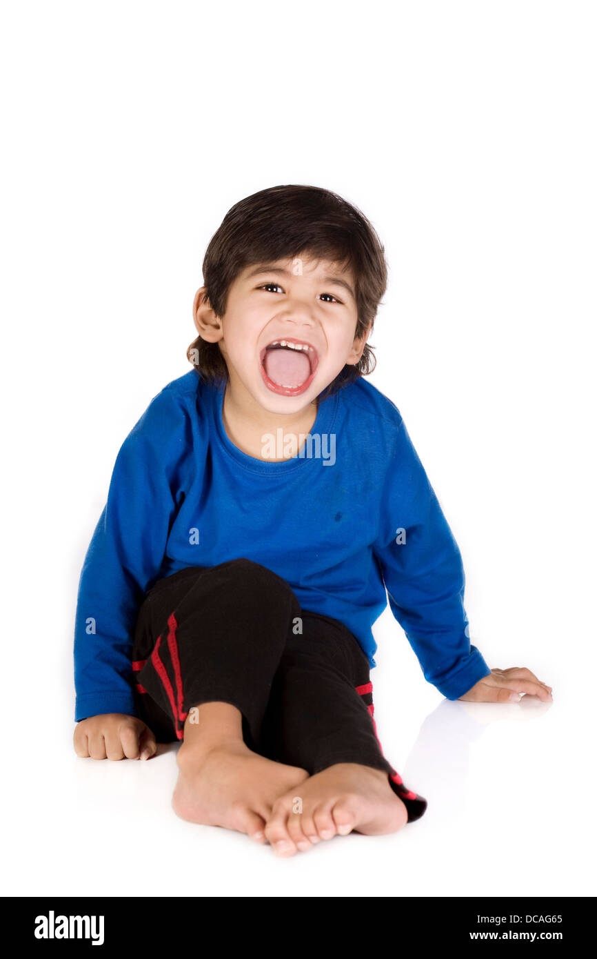 Little disabled boy sitting, isolated Stock Photo - Alamy