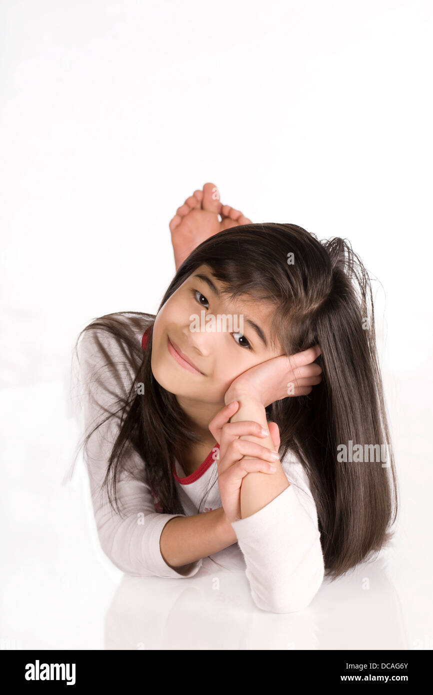 Girl chin on hand smiling Stock Photo - Alamy