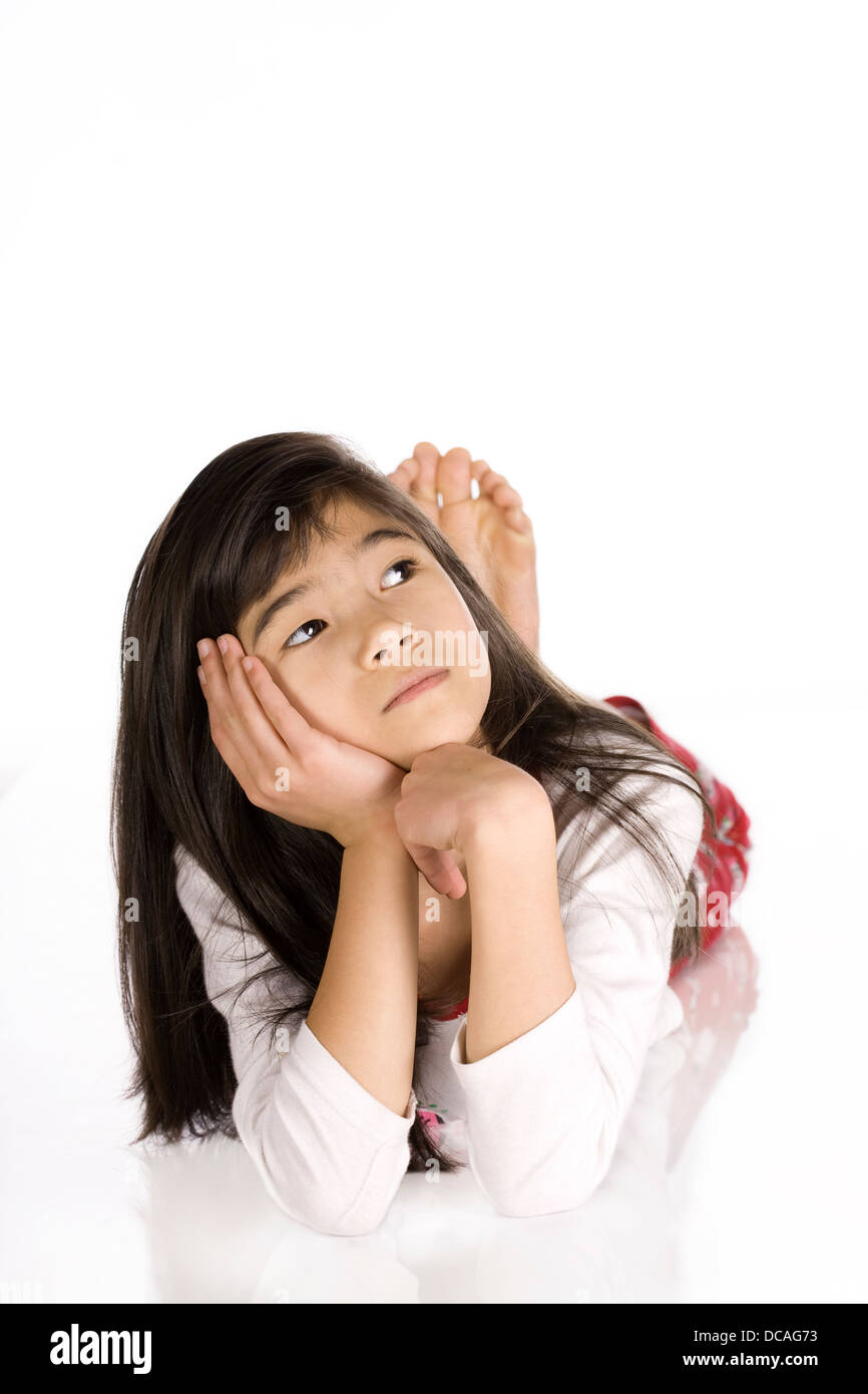Little girl deep in thought Stock Photo - Alamy